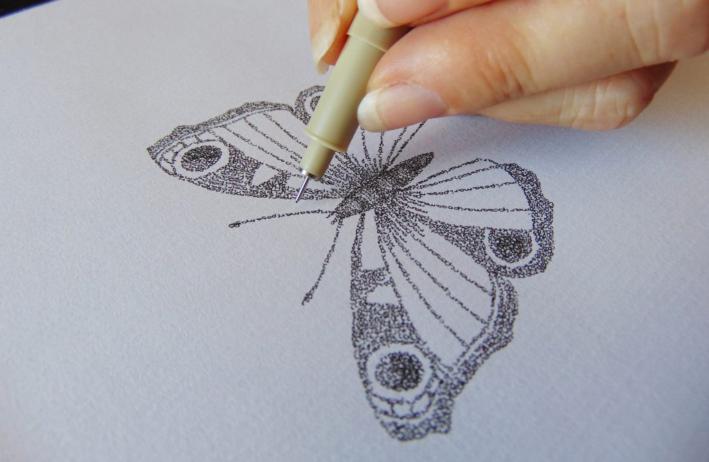 calligram butterfly with hand and pen - Mirjam Polman